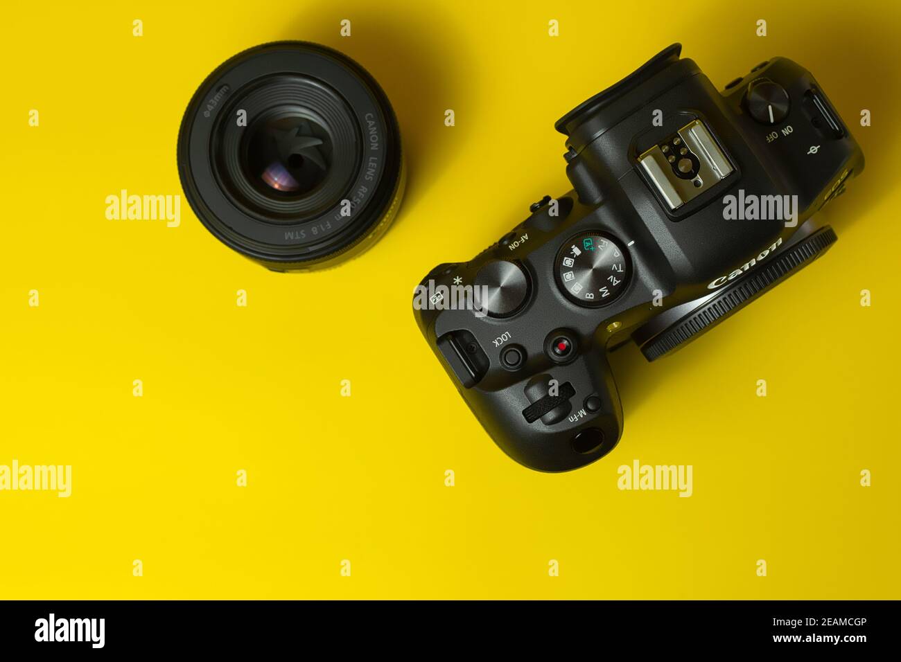 Canon r6 digital camera close-up, yellow background, glare Stock Photo ...