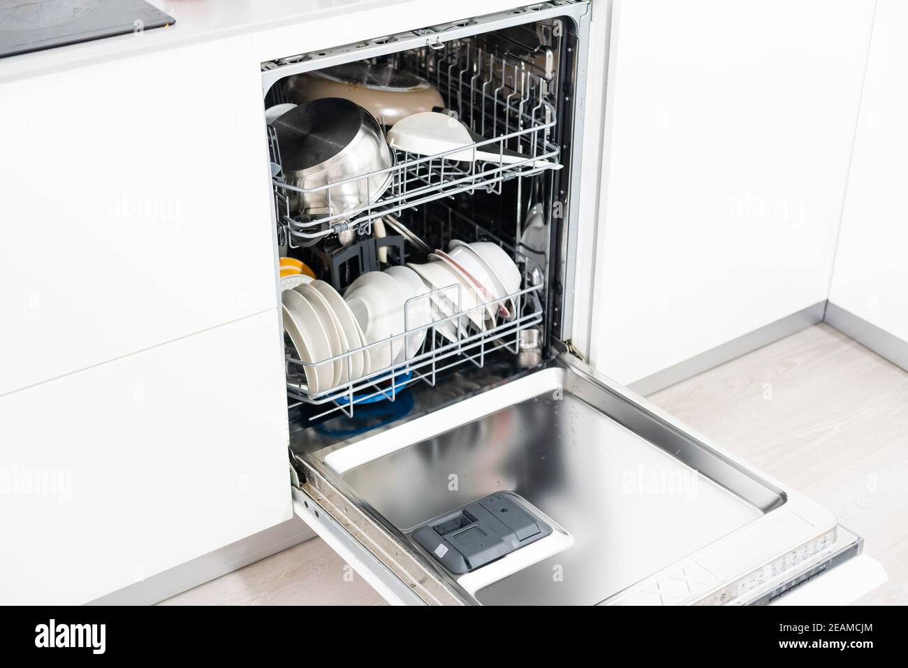 Picture of an opened dishwasher in the kitchen Stock Photo - Alamy