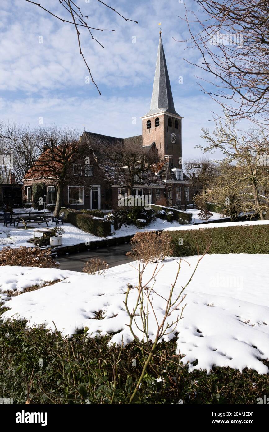 Mauritius church with houses in the city of IJlst in Friesland in ...