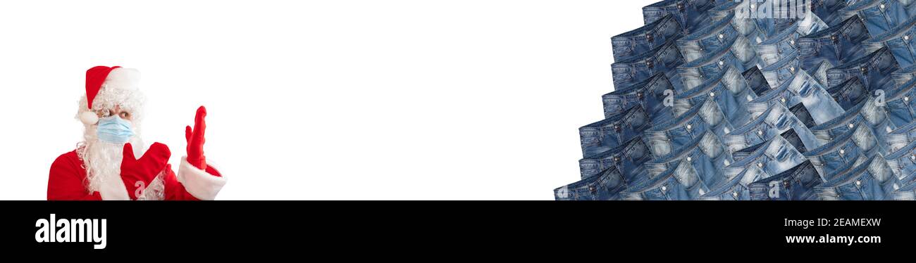 Santa Claus wearing mask, pointing at huge pile of blue jeans isolated ...