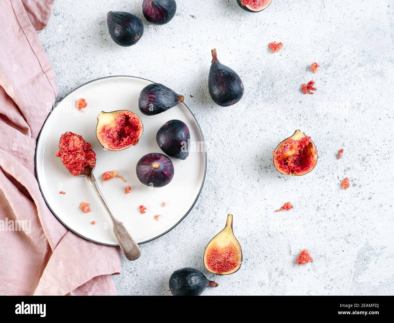 Whole and half figs isolated topview Stock Photo - Alamy