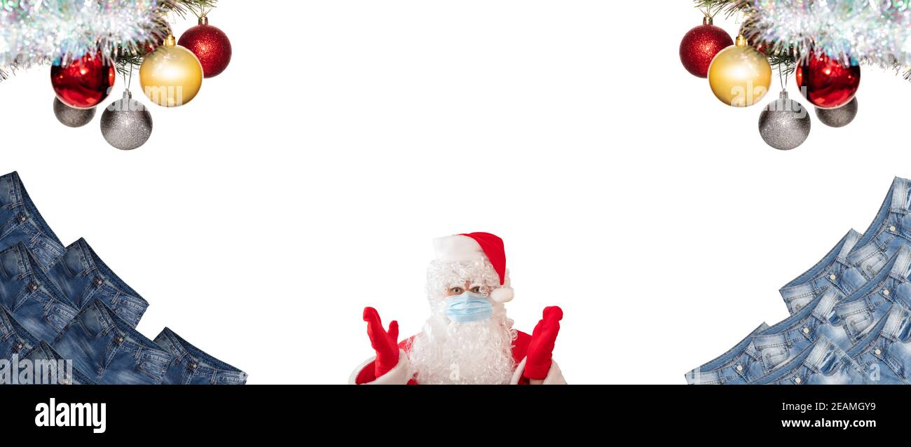 Santa Claus wearing mask, pointing at huge piles of blue jeans isolated ...