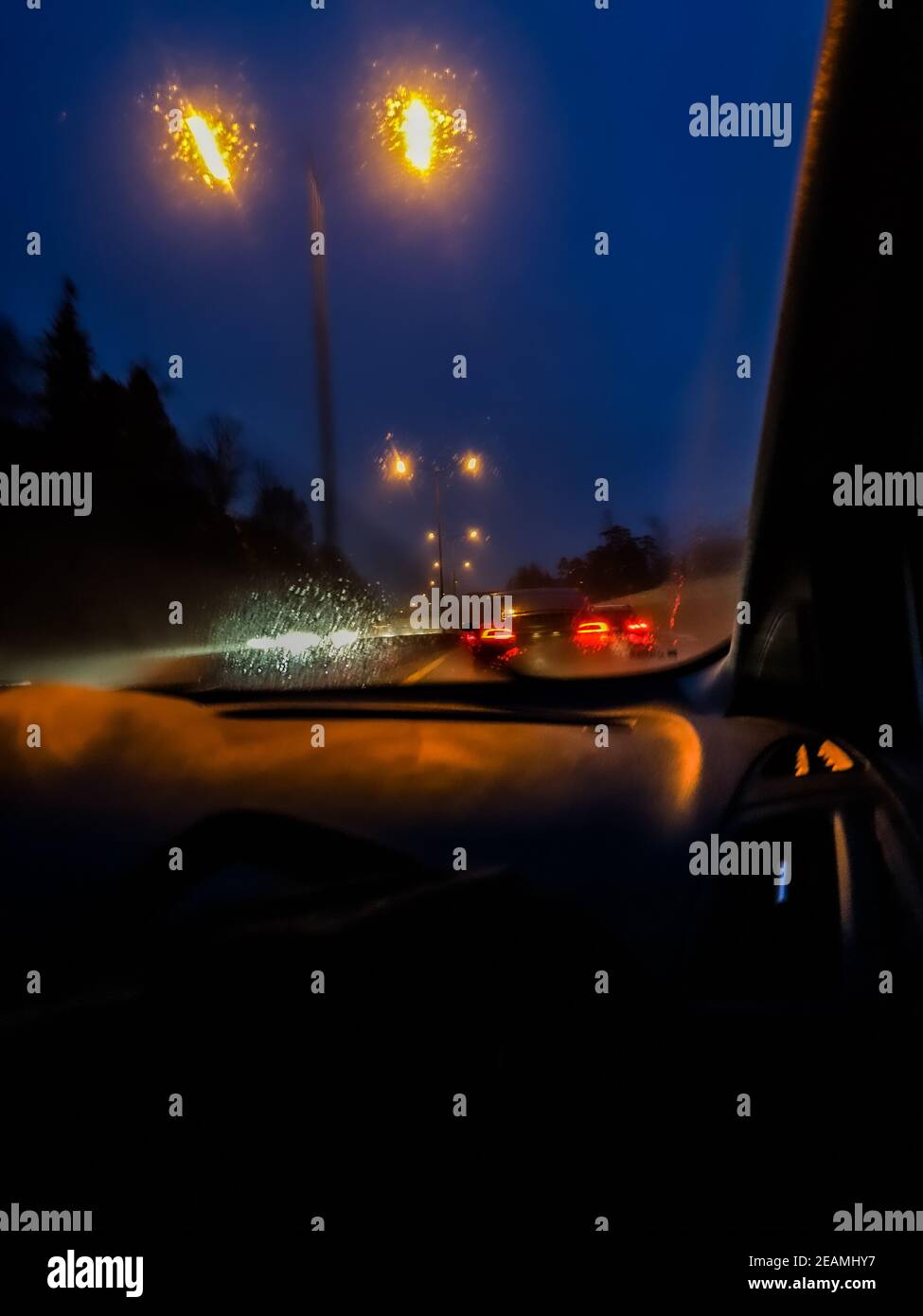 driving a car on a rainy evening - Oslo Stock Photo - Alamy