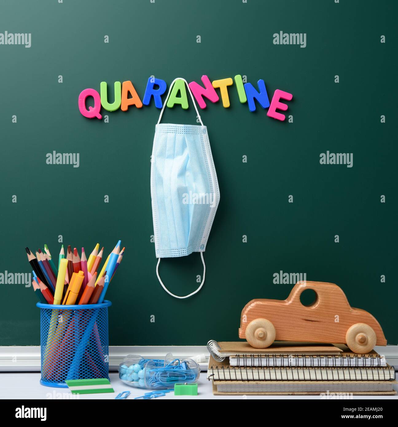 inscription quarantine from multi-colored plastic letter on a green ...