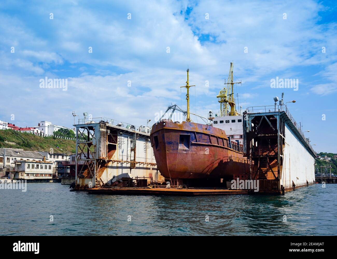 Landscape with a floating dock and a rusty ship inside. Sevastopol ...