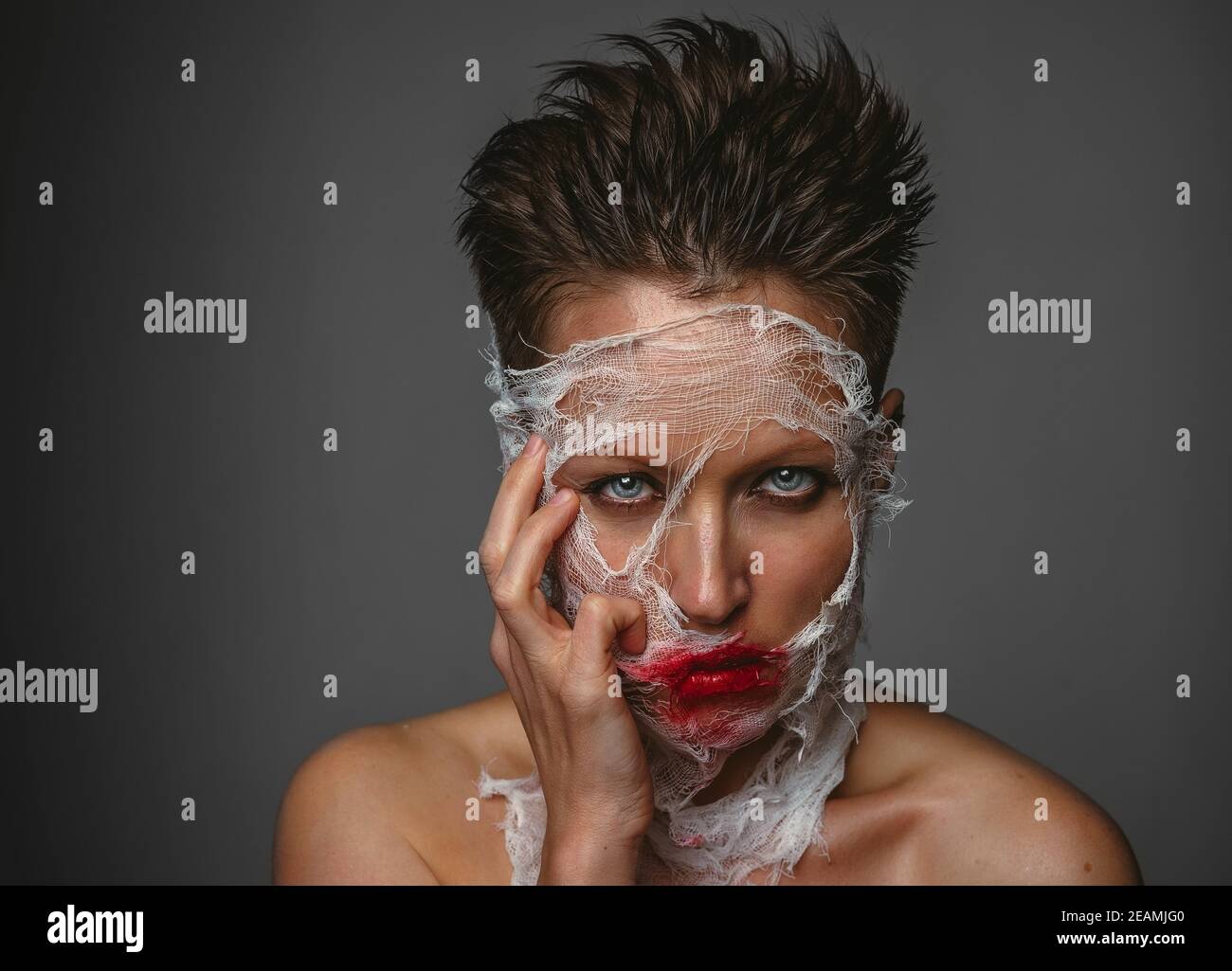 Feshion portrait, women with a mask on her face, horror, high fashion ...