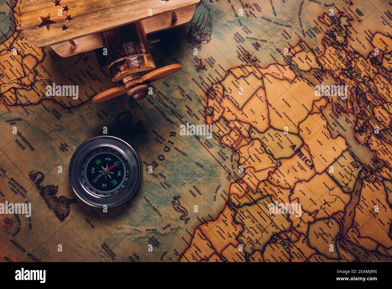 Old compass discovery and wooden plane on vintage paper antique world ...