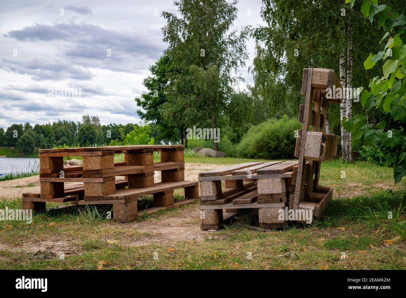 Rustic wooden table and benches from wood pallets Stock Photo - Alamy