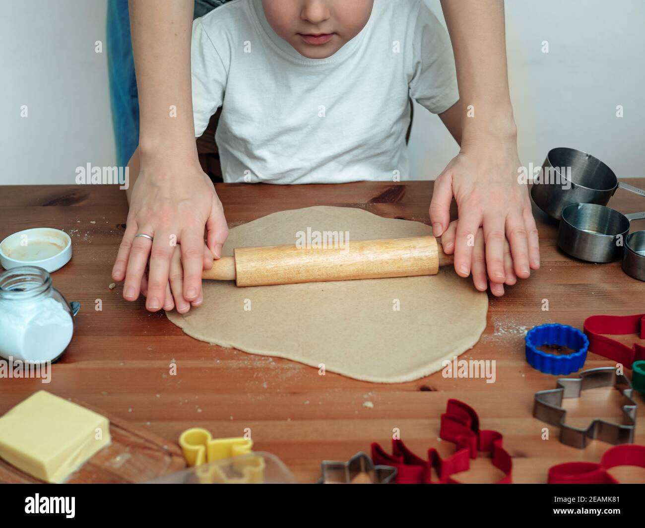Young mother and son in kitchen making cookies Stock Photo - Alamy