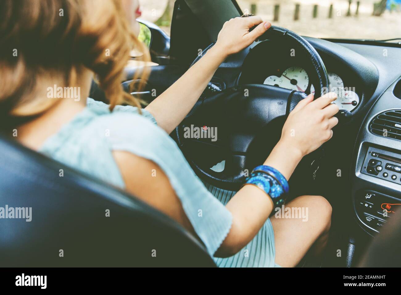 Attractive woman driving car. Woman in car. Female driver back view ...