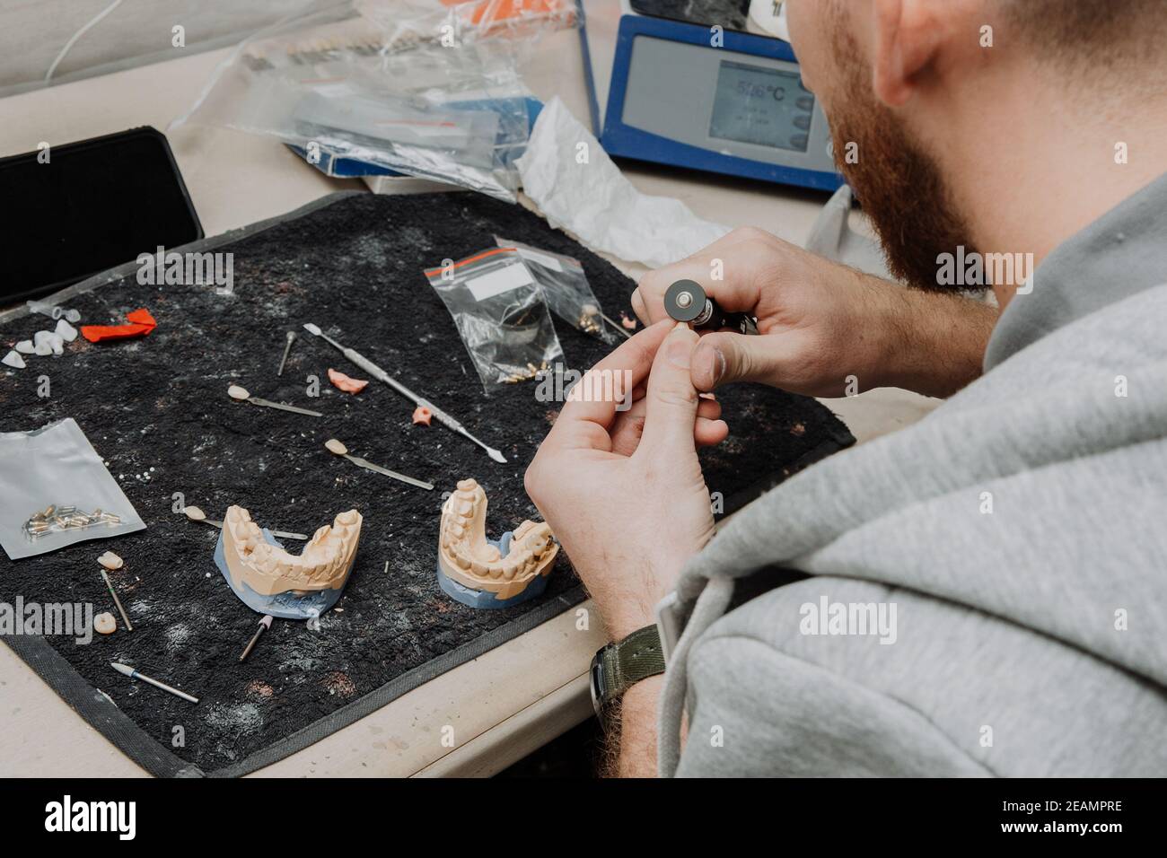 Dental Technician Working On A 3D Printed Mold For Tooth Implants In ...