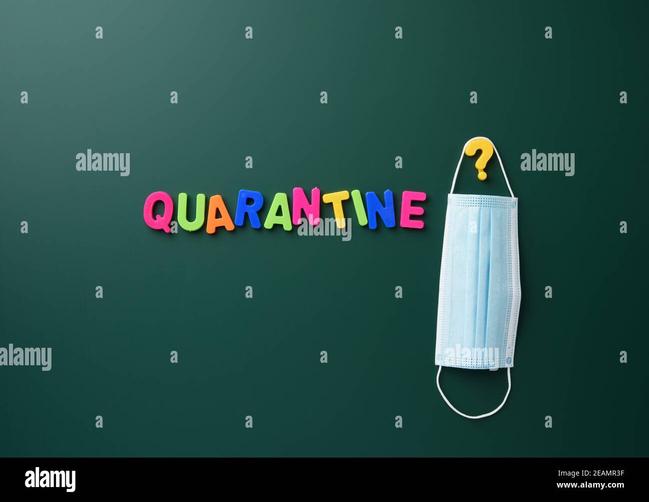 inscription quarantine from multi-colored plastic letter on a green ...