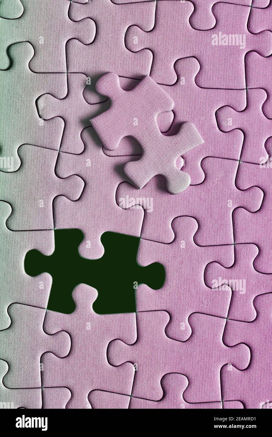 Jigsaw puzzle background, almost done Stock Photo - Alamy