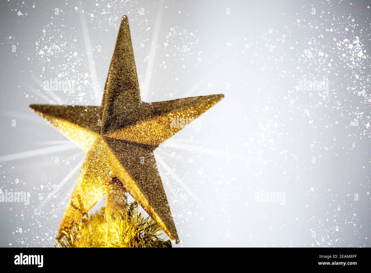 gold christmas star in top of the tree Stock Photo - Alamy