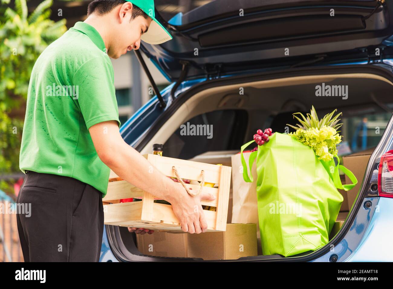 Delivery man grocery prepare fresh vegetables food in wooden basket on ...