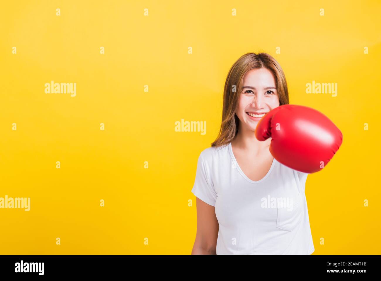 Young woman standing smile in boxing gloves Stock Photo - Alamy