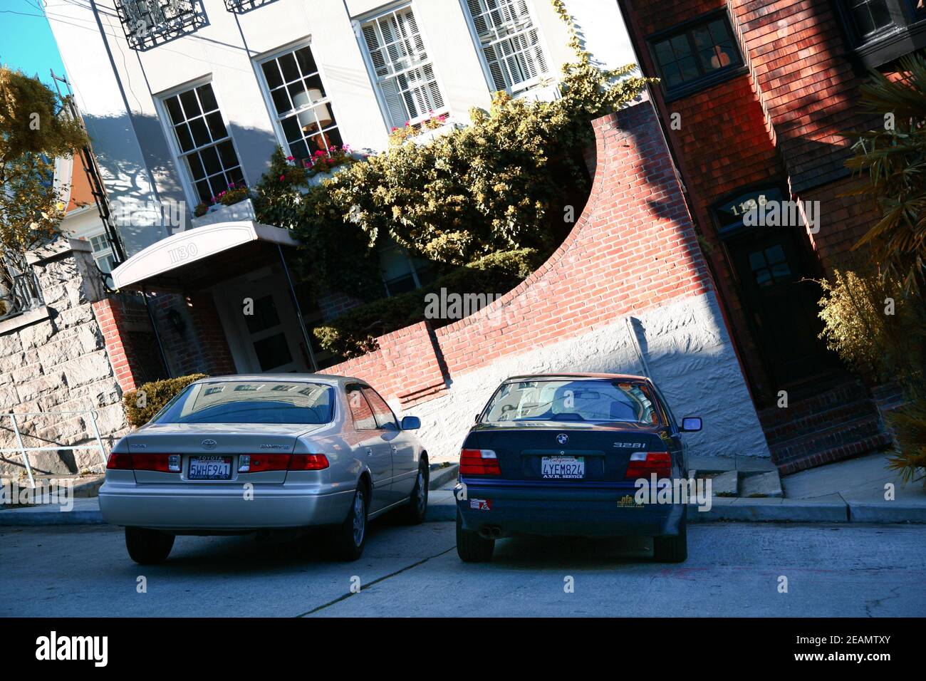 Cars parked in typical sloped streets in San Francisco Stock Photo - Alamy