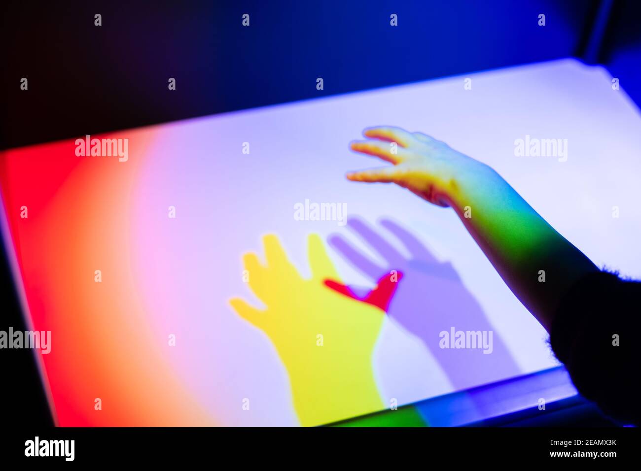 Prism rainbow light and shadow of a hand Stock Photo - Alamy