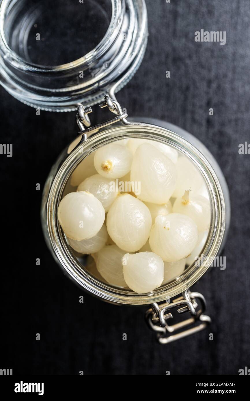 Pickled mini baby onions in jar Stock Photo - Alamy