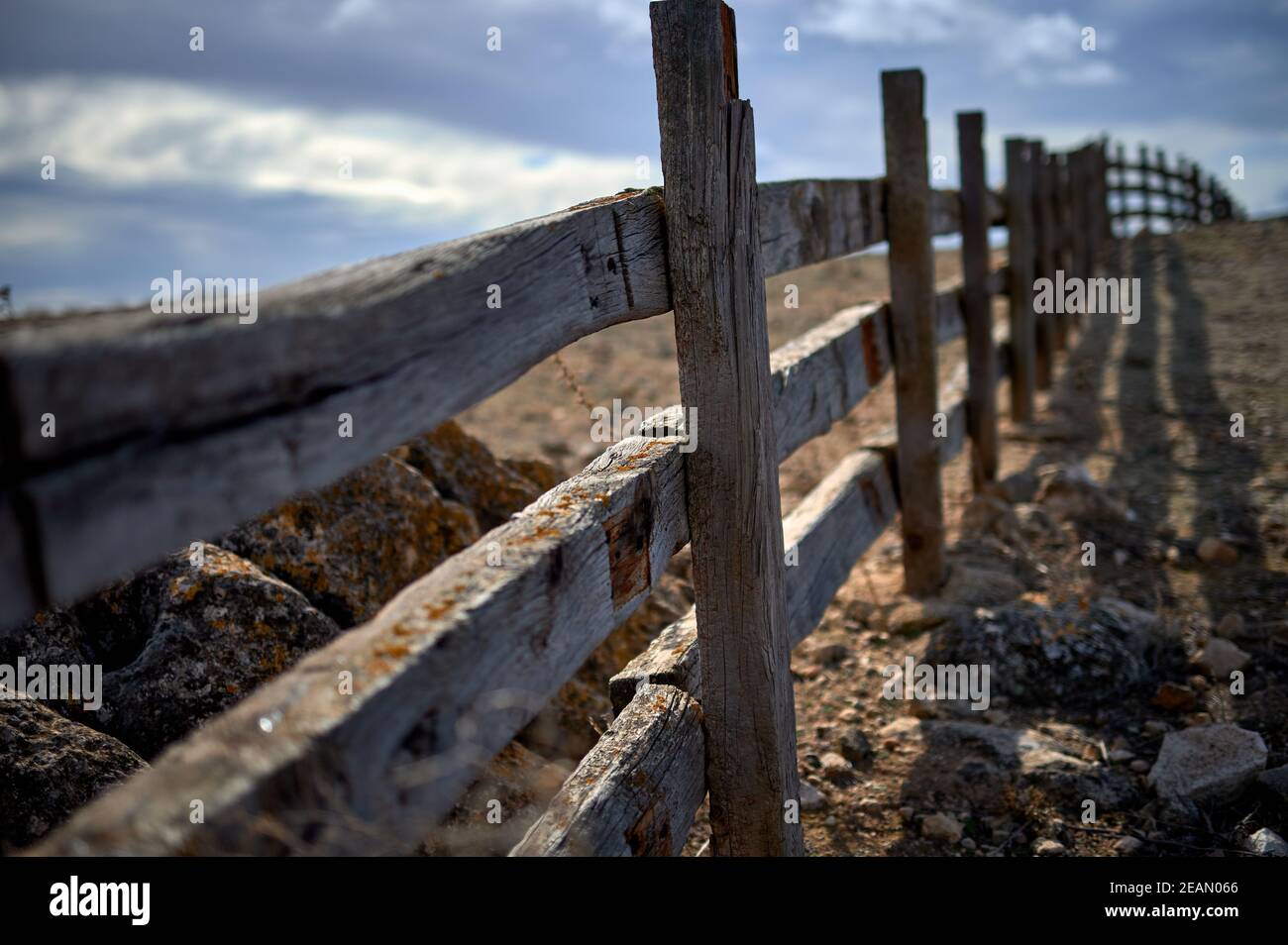 detail of a part of a wooden fence very deteriorated by the weather ...