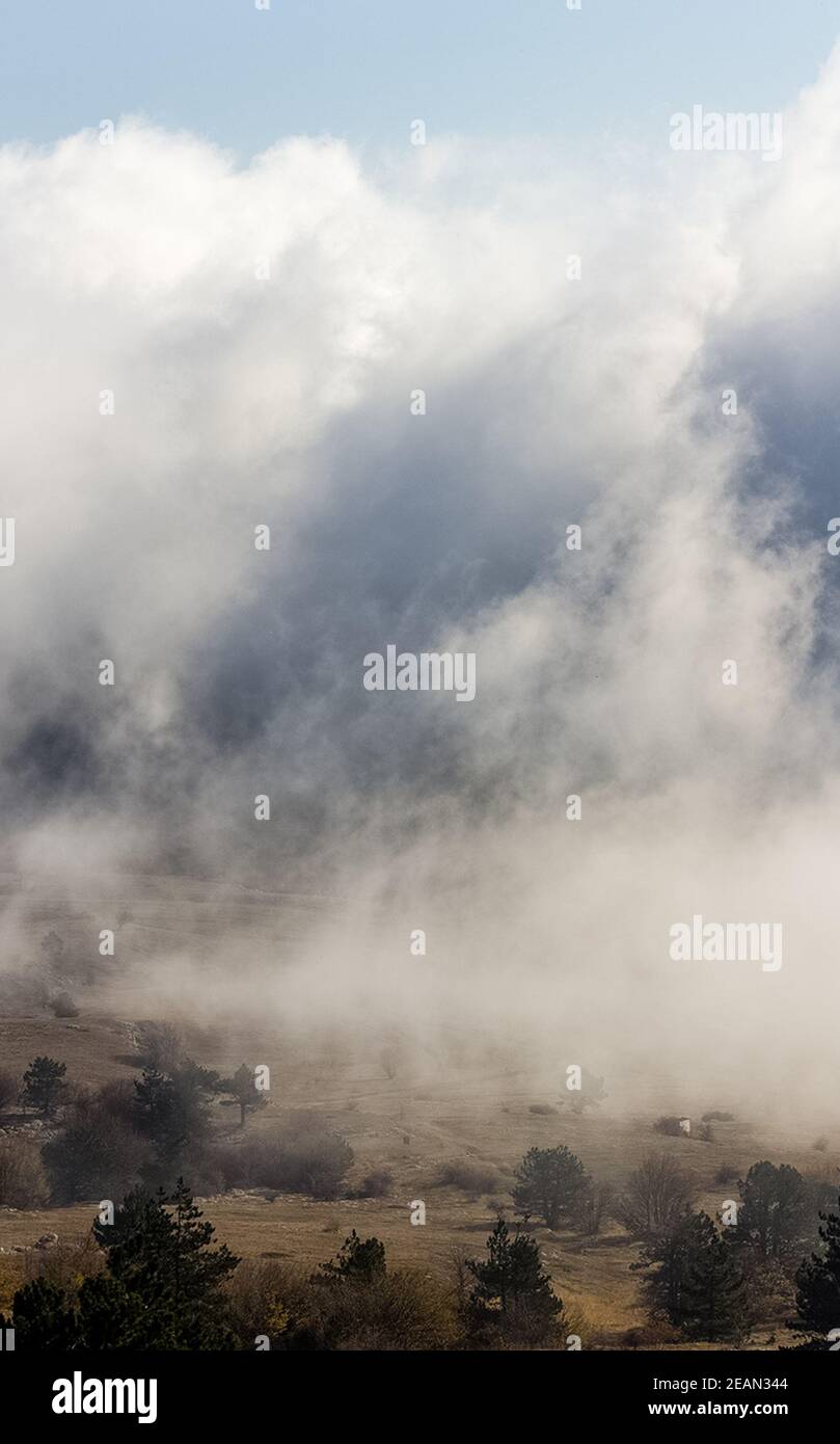 Aerial view overlooking cloudy valley hi-res stock photography and ...