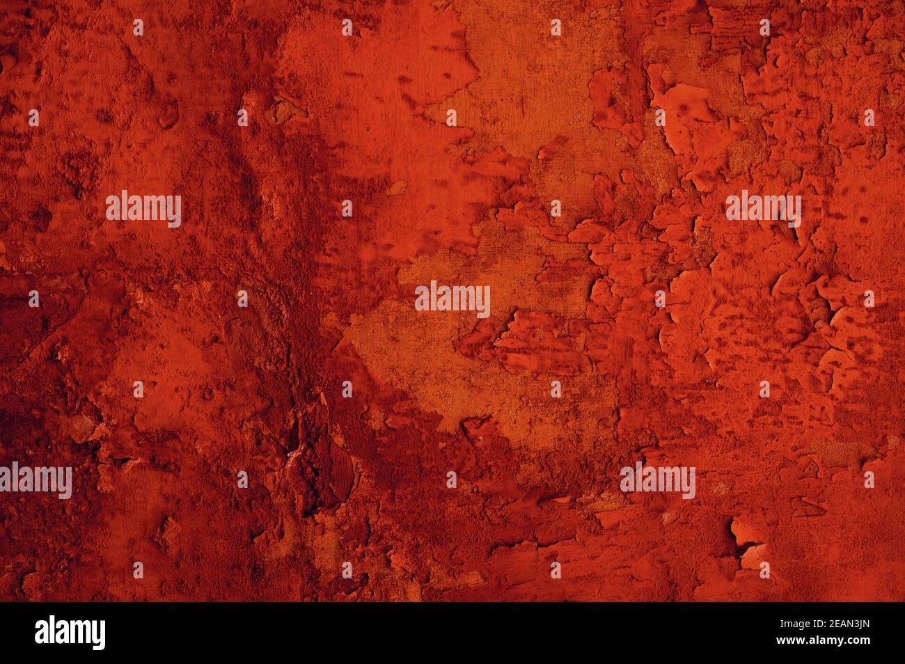 Weathered red color on old wall Stock Photo - Alamy