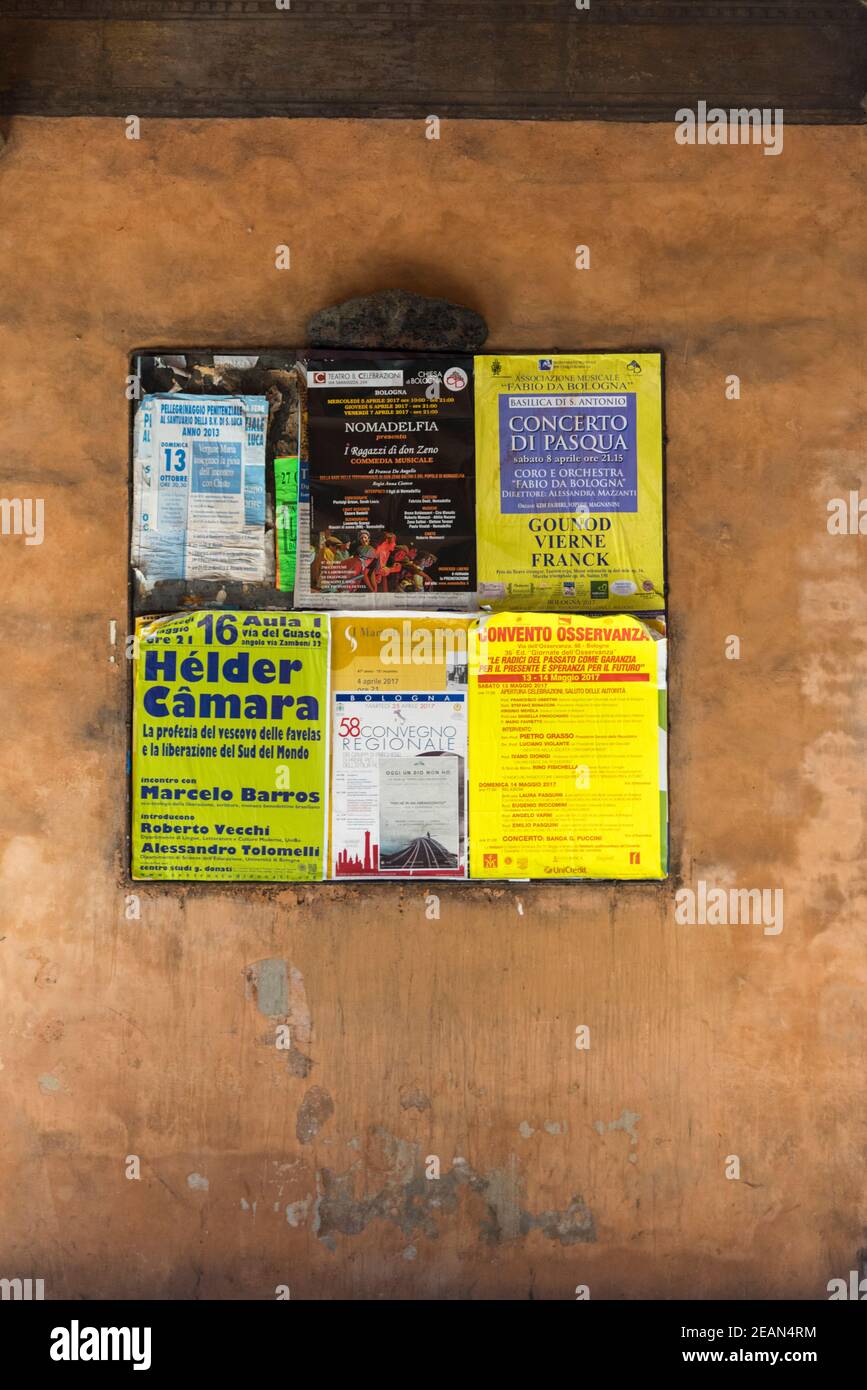 A notice board with advertising posters and flyers on in Bologna Italy ...