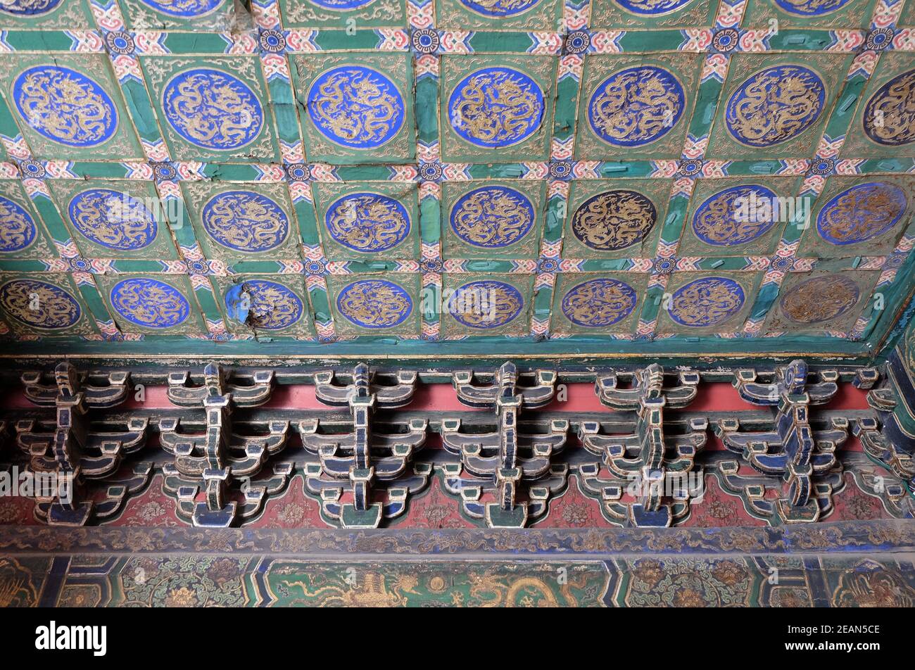 Ornate painted ceiling on a building in the Forbidden City in Beijing ...