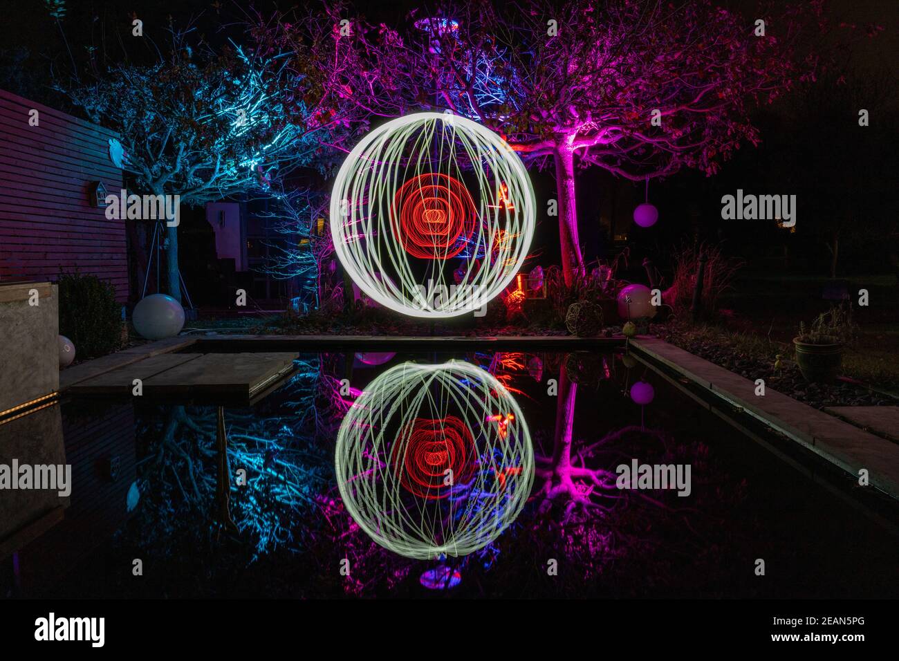 Light painting with colorfully illuminated trees Stock Photo - Alamy