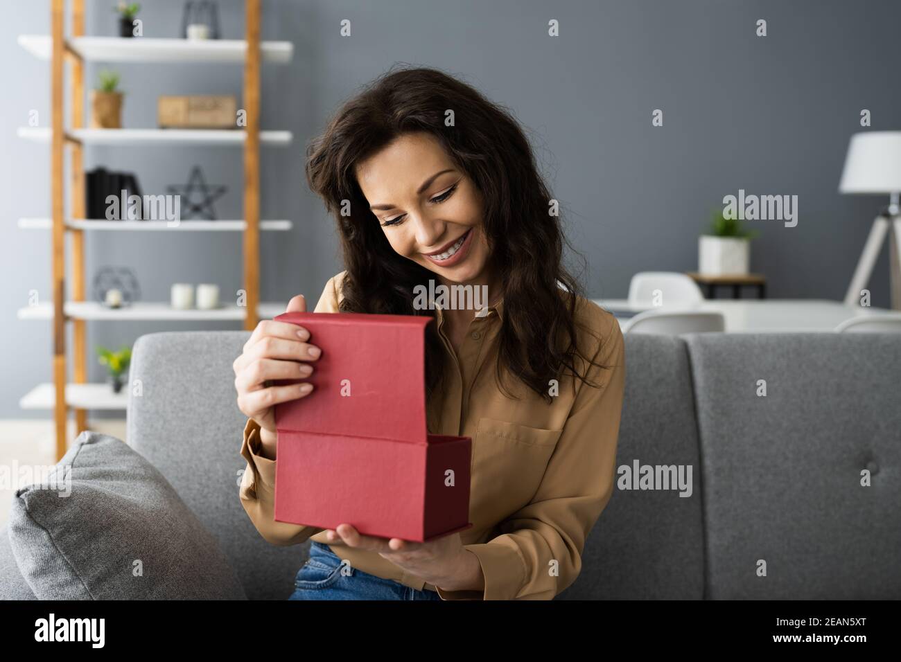 Happy Woman Sitting Stock Photo - Alamy