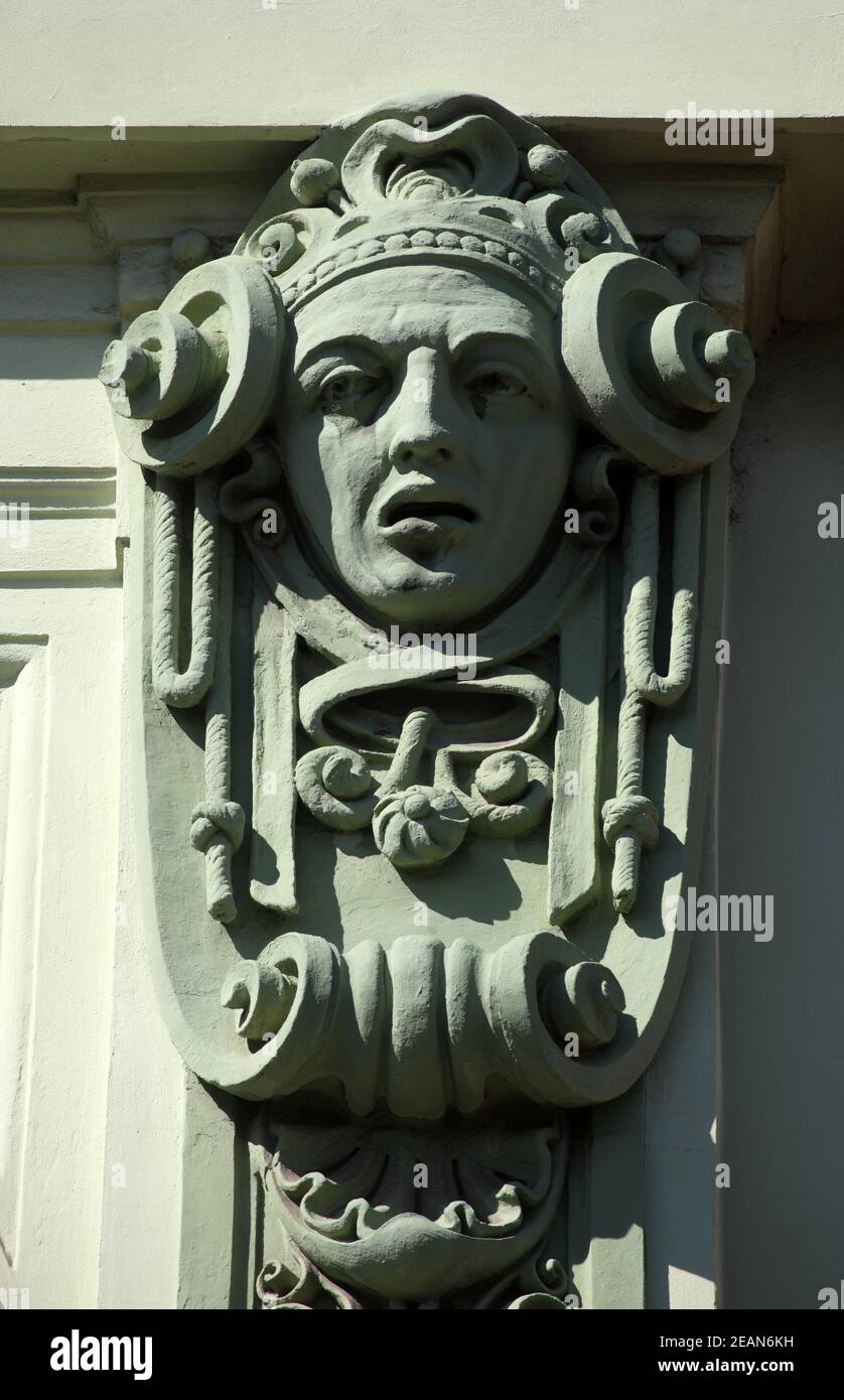 Architectural detail with a mascaron of a young woman set on top of a ...