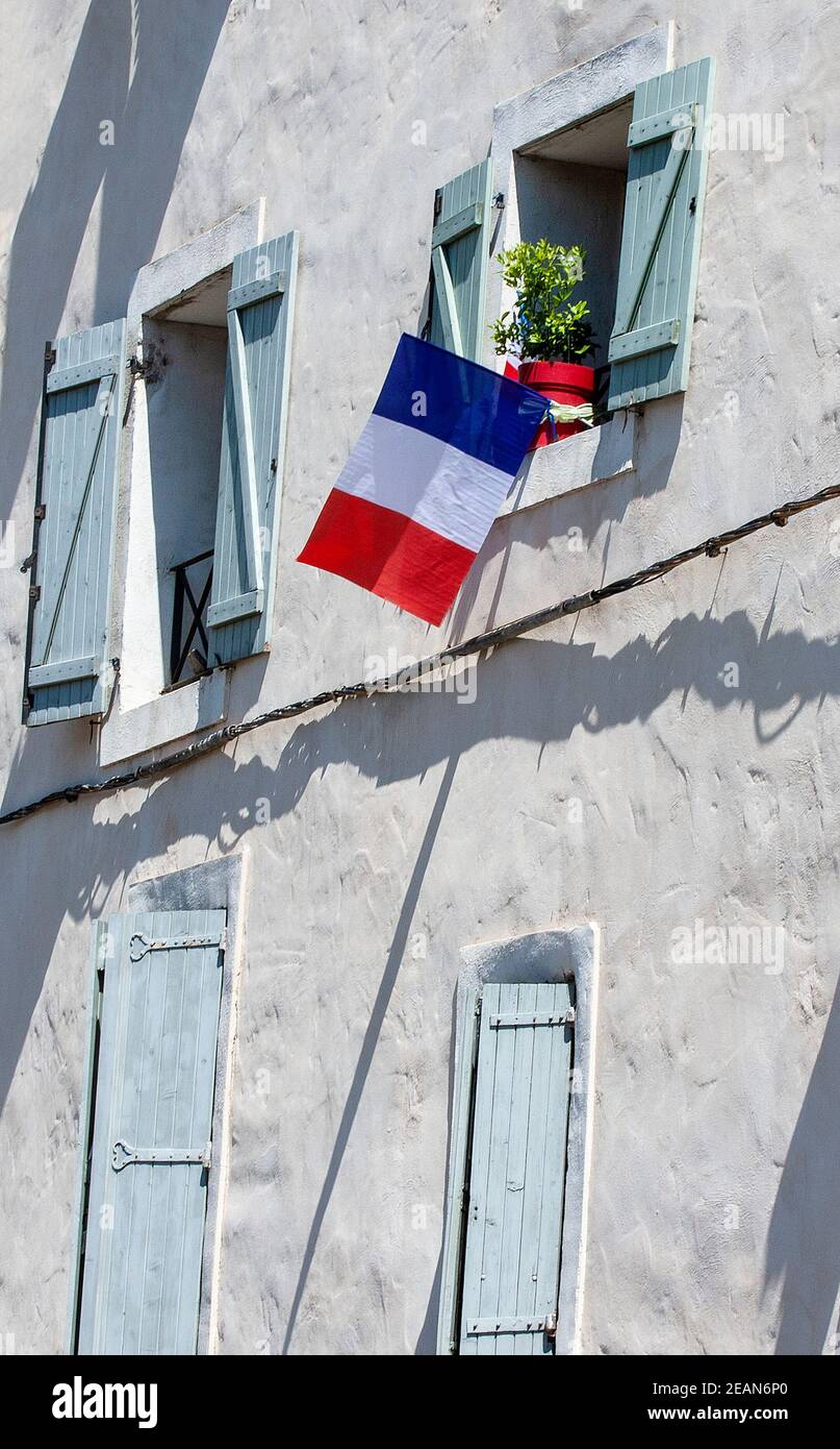 facade of the building with the flags of France in the window Stock ...