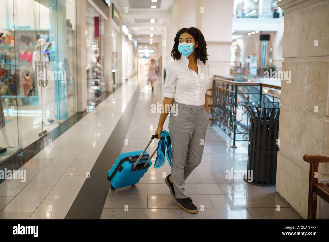 Lady walking in mall hi-res stock photography and images - Alamy