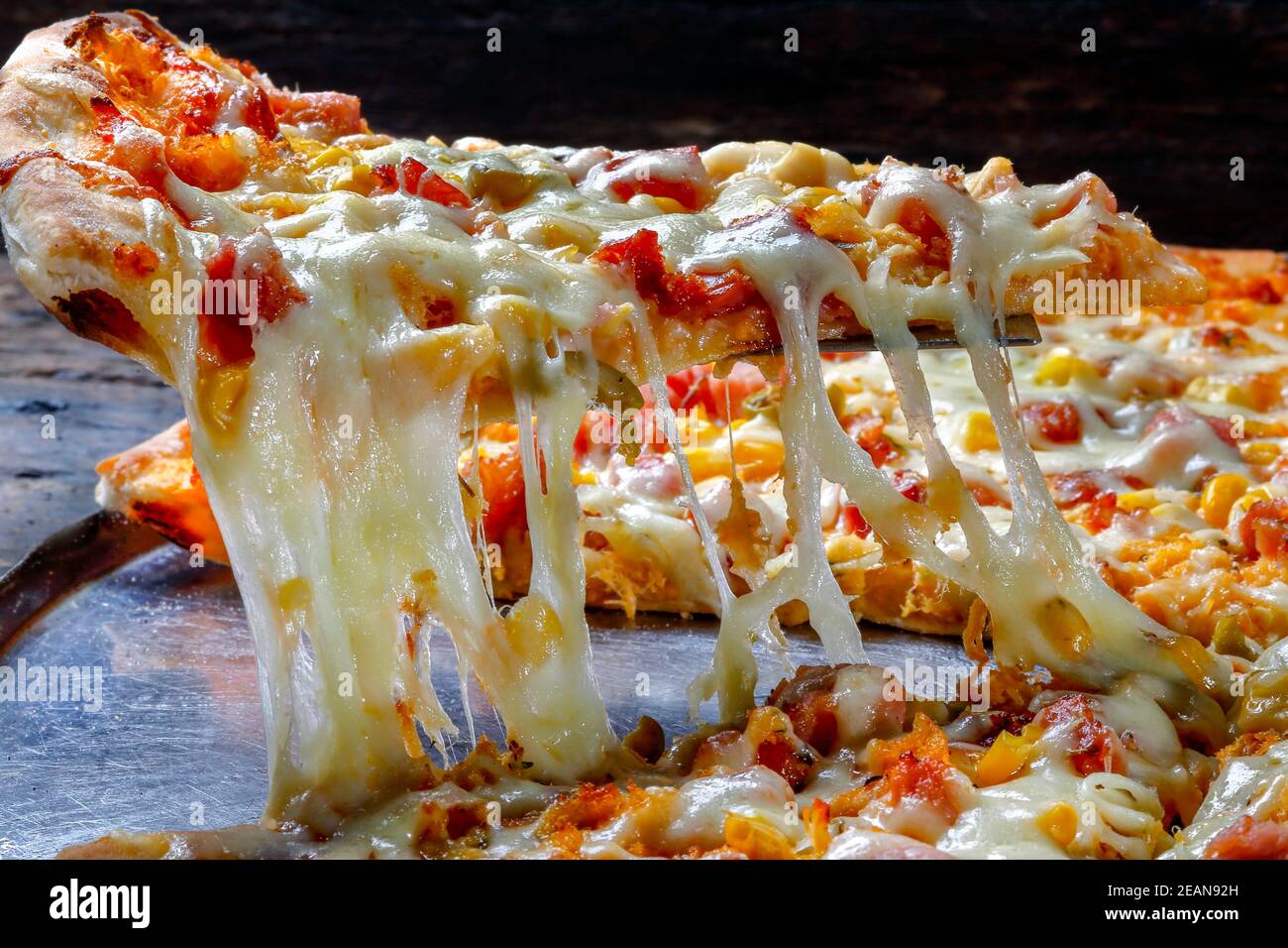 Pizza slice melted cheese Stock Photo - Alamy