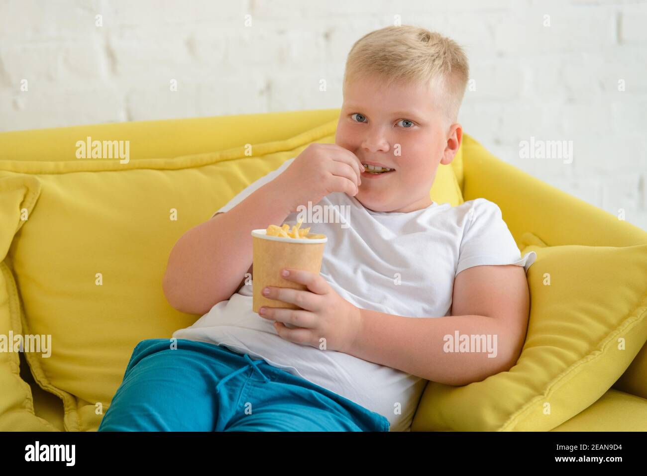 Obese boy couch hi-res stock photography and images - Alamy