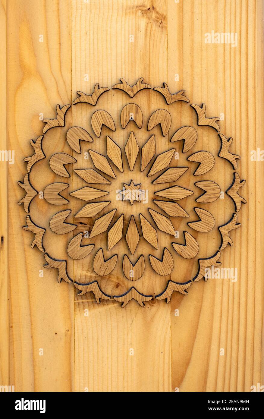 Floral motifs carved on wooden board by a folk artist Stock Photo - Alamy