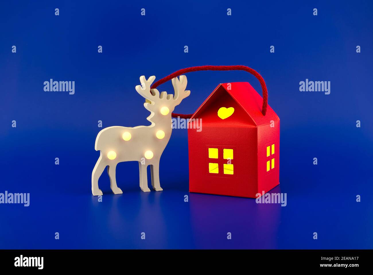 Stylized wooden reindeer and house shaped gift box Stock Photo - Alamy