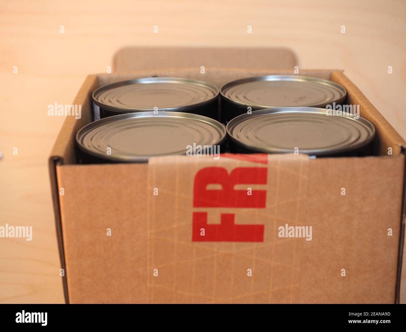 Fragile cardboard box with tin cans Stock Photo - Alamy