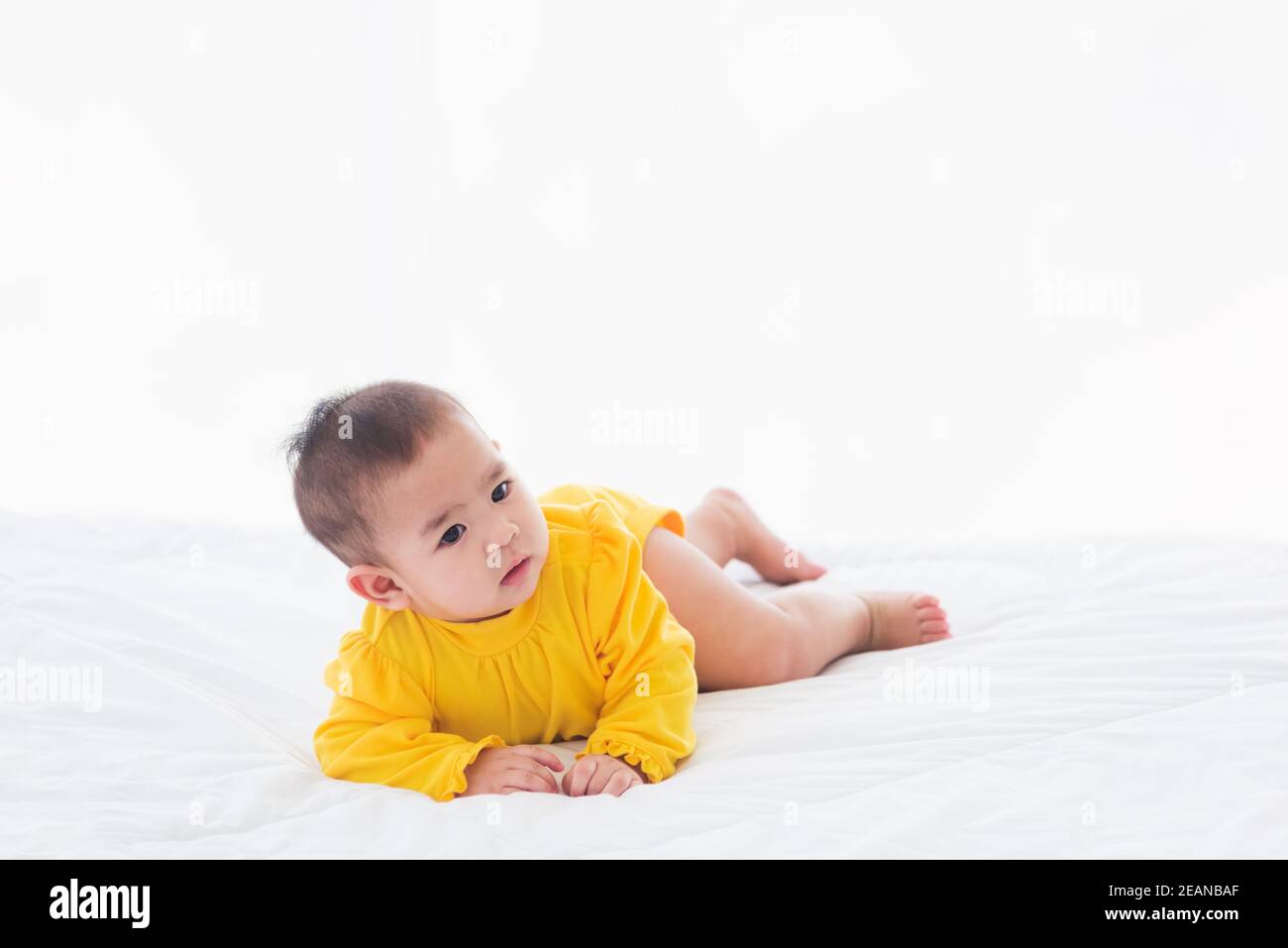 newborn little baby prone on the bed at home Stock Photo - Alamy