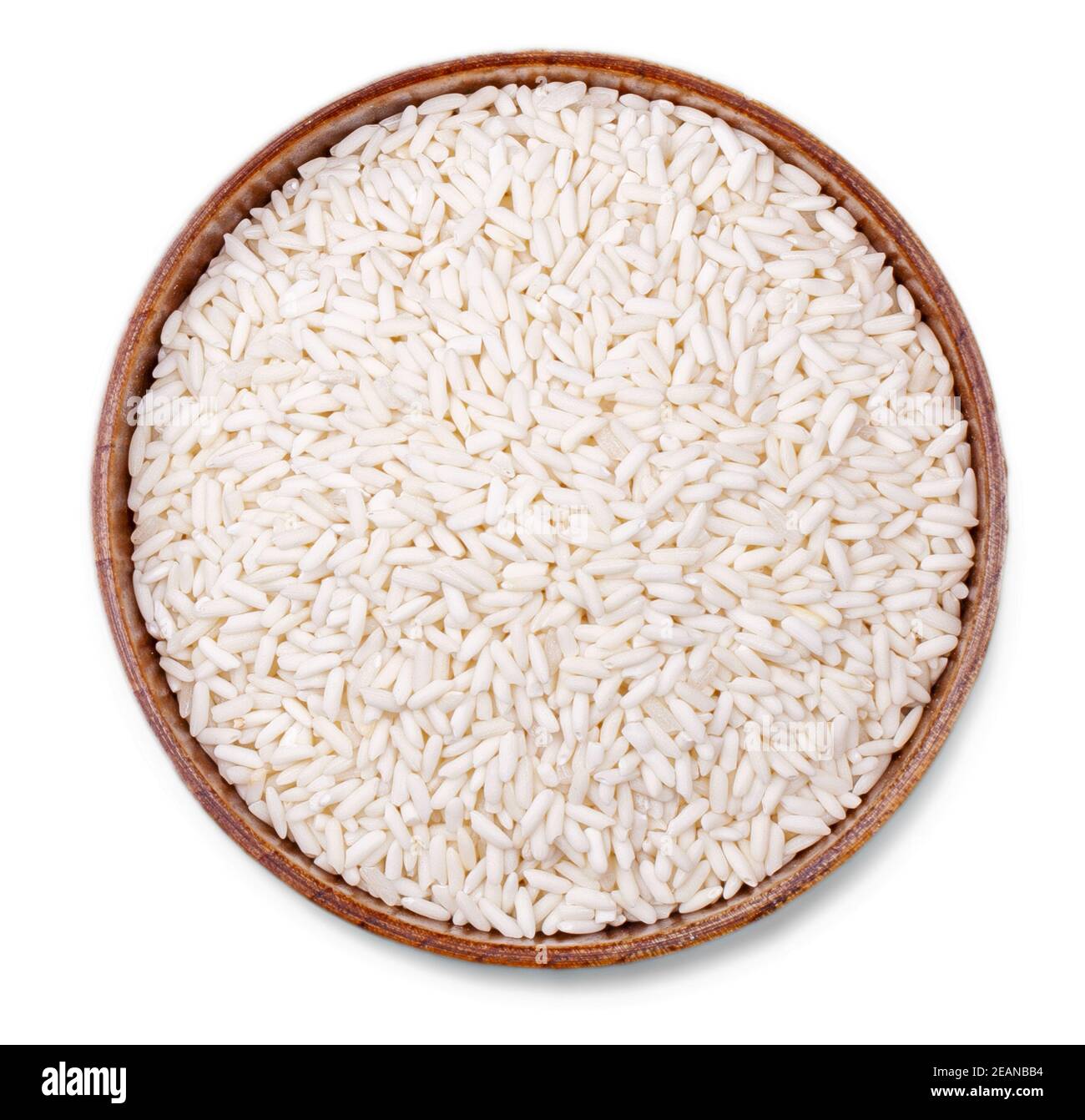 White rice in wooden bowl isolated on white background with clipping ...
