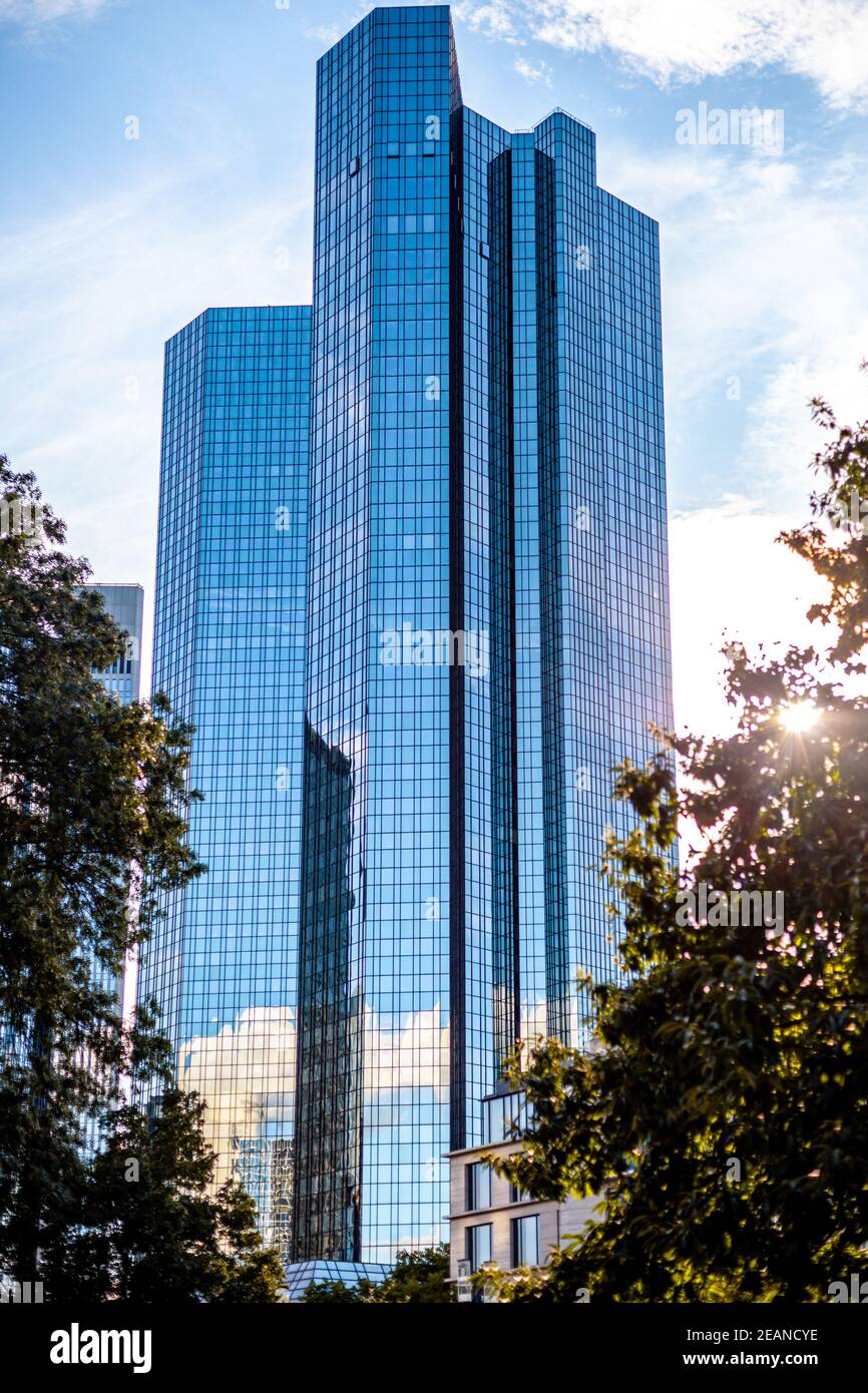 skyscraper in the big city touching the blue sky Stock Photo - Alamy