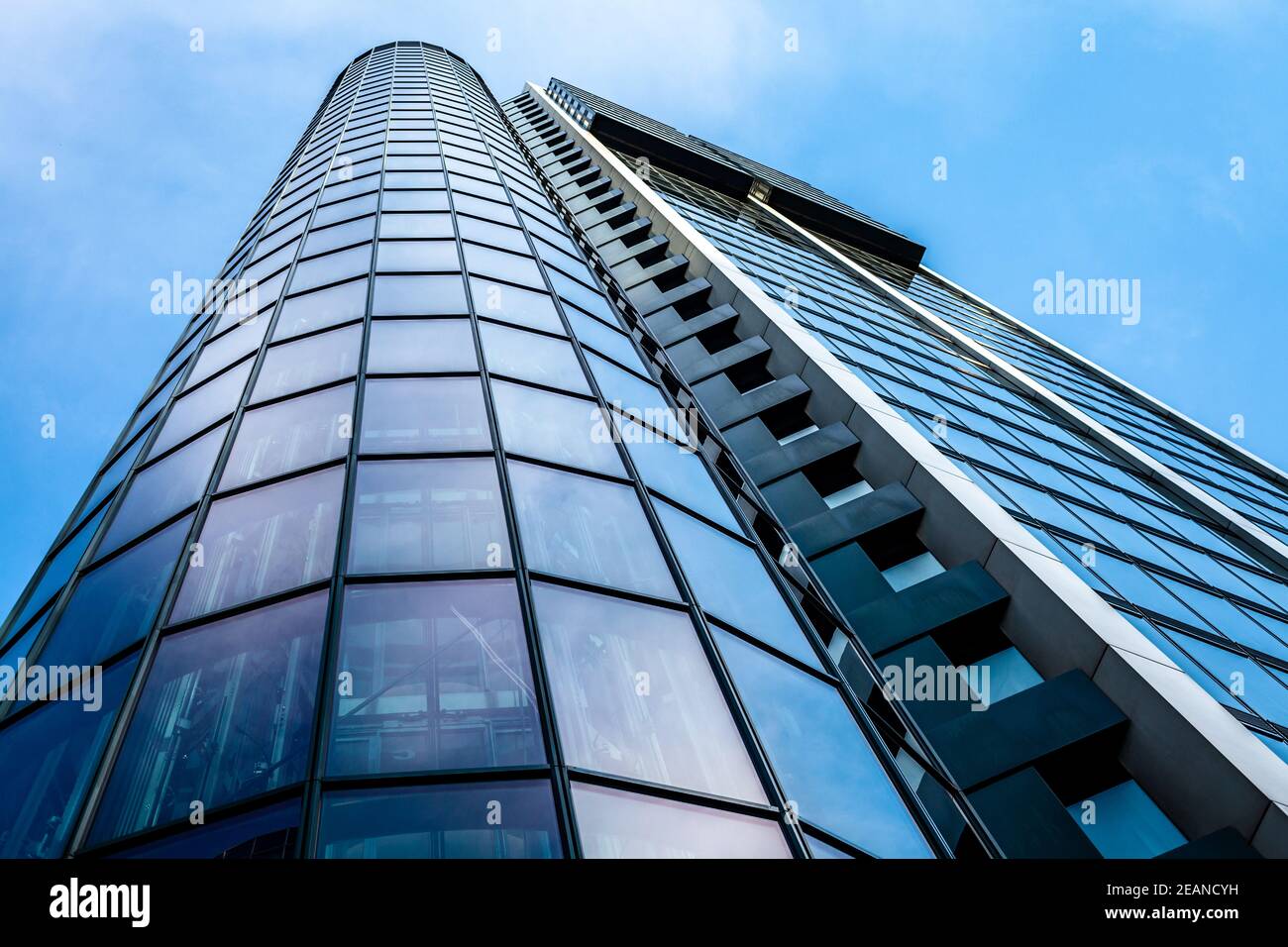 glass wall of skyscraper, blue sky Stock Photo - Alamy