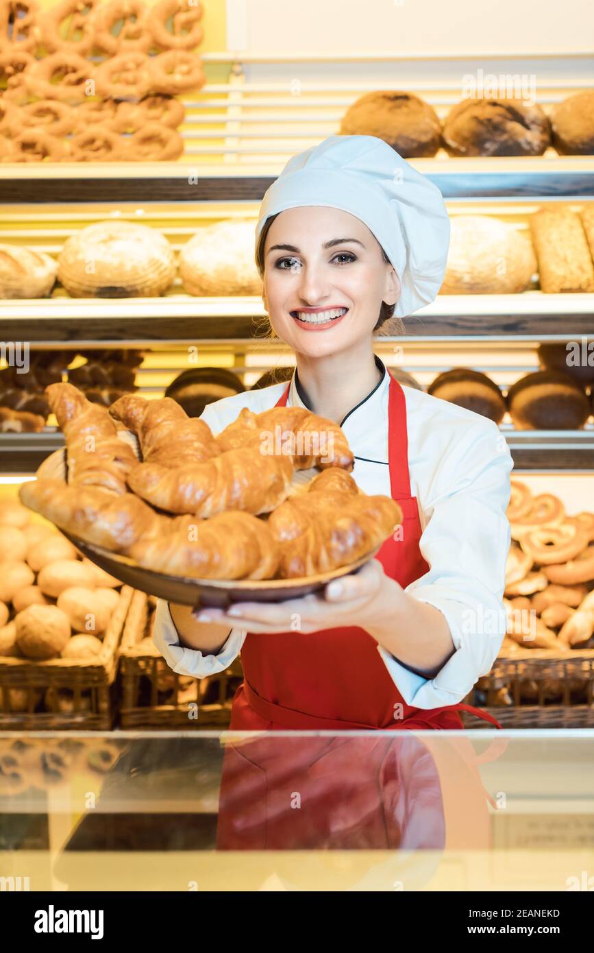 Woman offering bread hi-res stock photography and images - Alamy