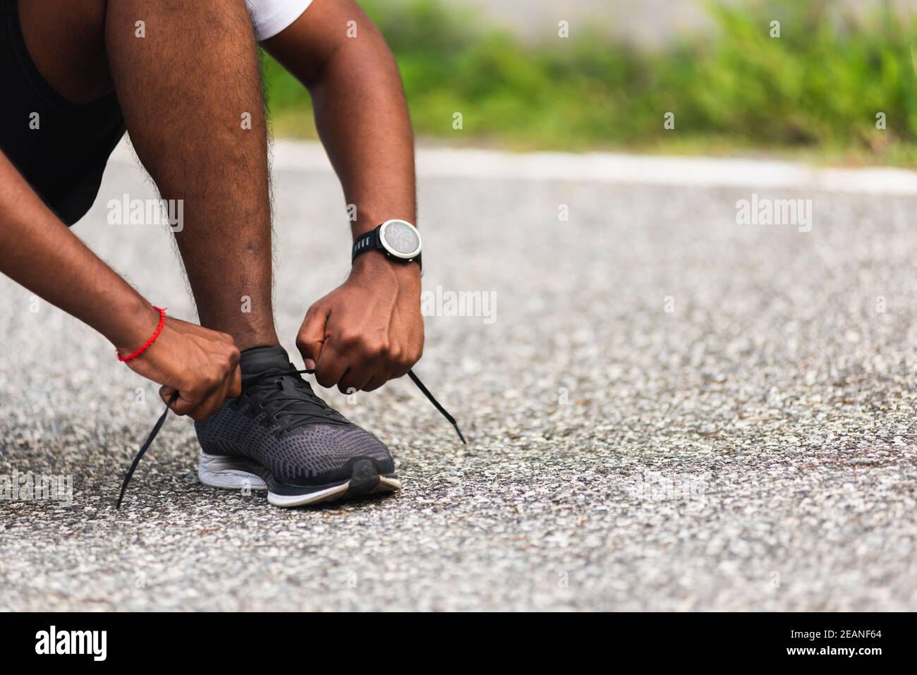 sport runner black man wear watch sitting he trying shoelace running ...