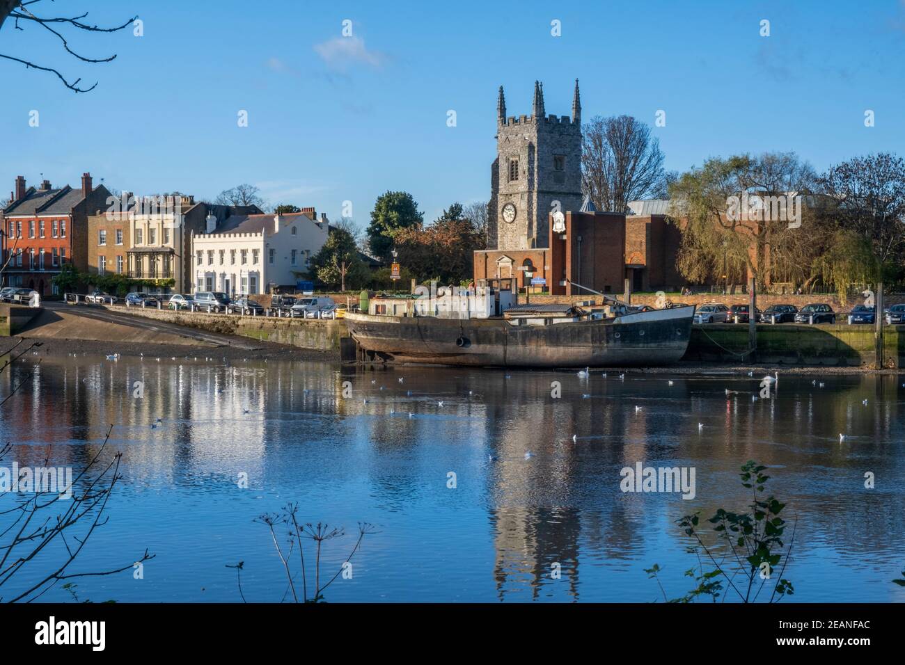 All Saints Church, Isleworth town centre, seen from the Thames Path in ...