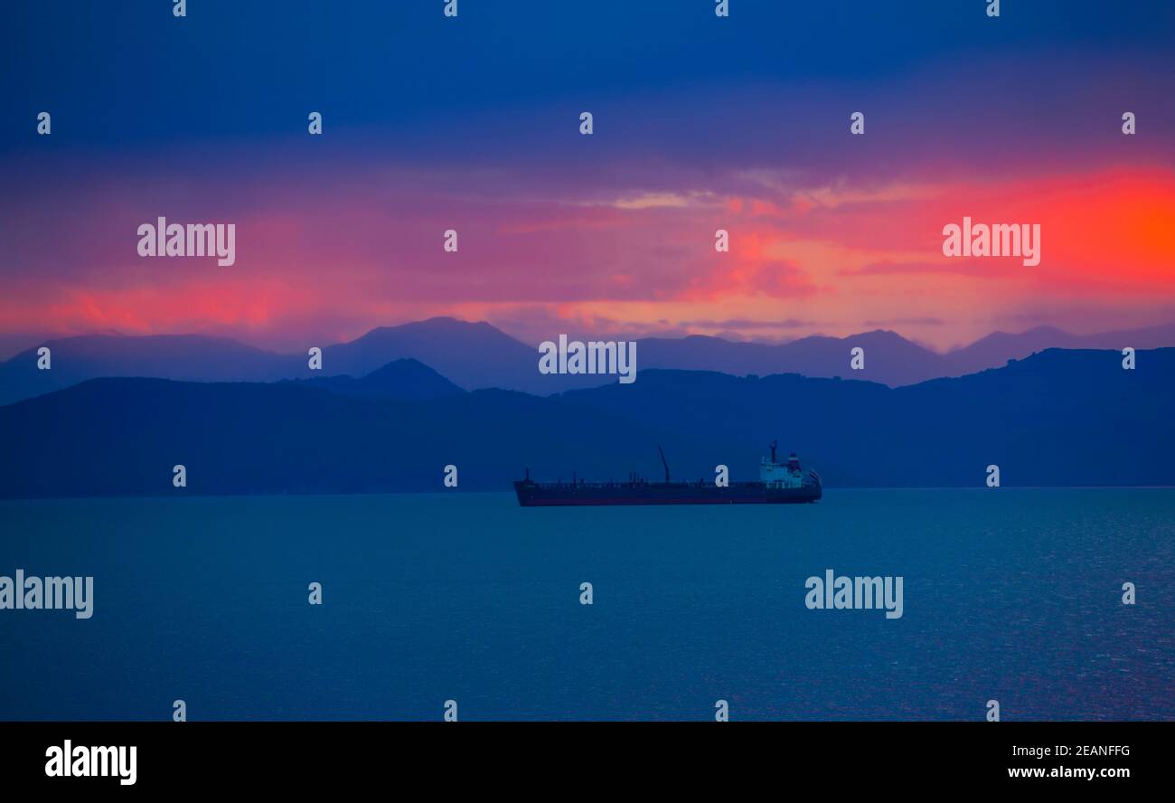 transport ship at sunset in the Avacha Bay on the Kamchatka Peninsula ...