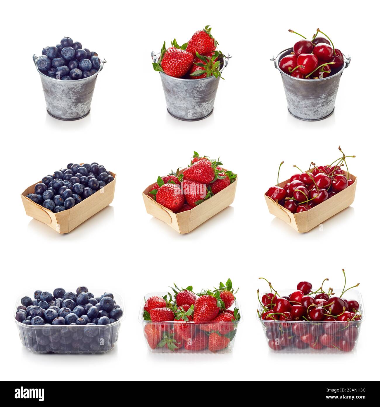 blueberry, strawberry and cherry in metallic basket, wooden box and ...
