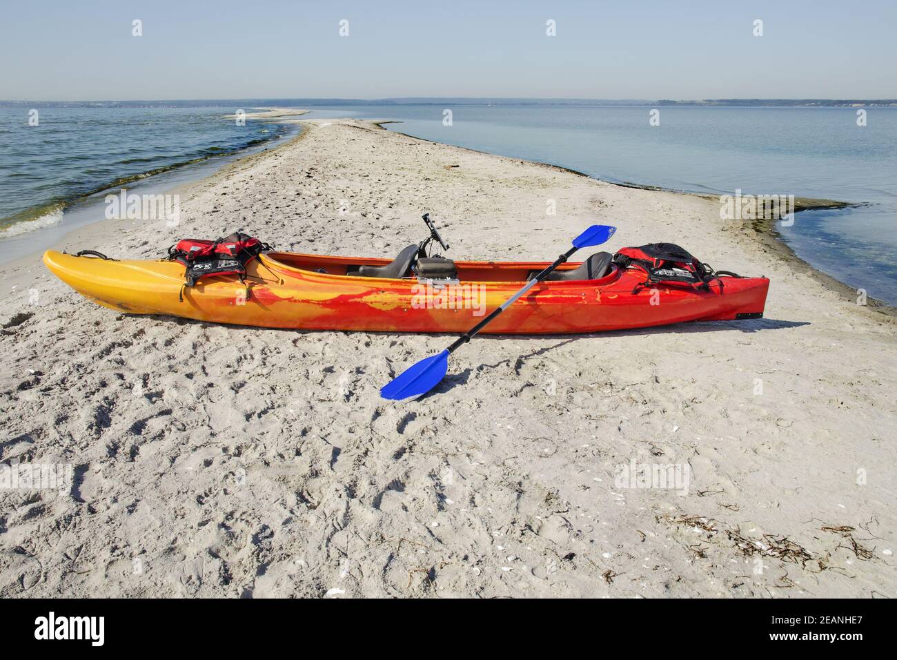Orange kayak on the sandy coast on Rewa Mew in Poland Stock Photo - Alamy