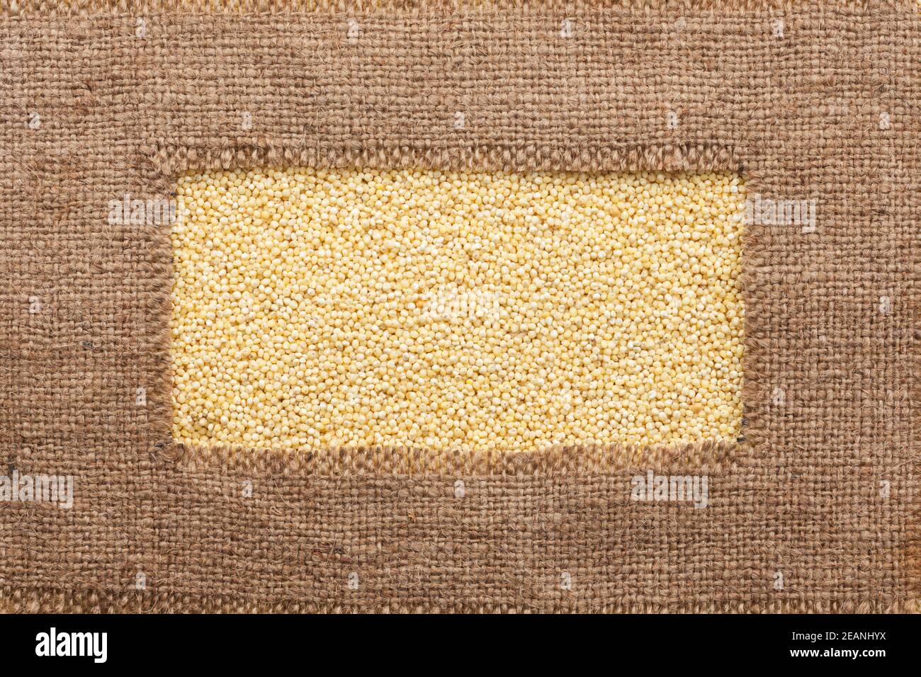 Frame made of rough burlap lies on millet grains Stock Photo - Alamy