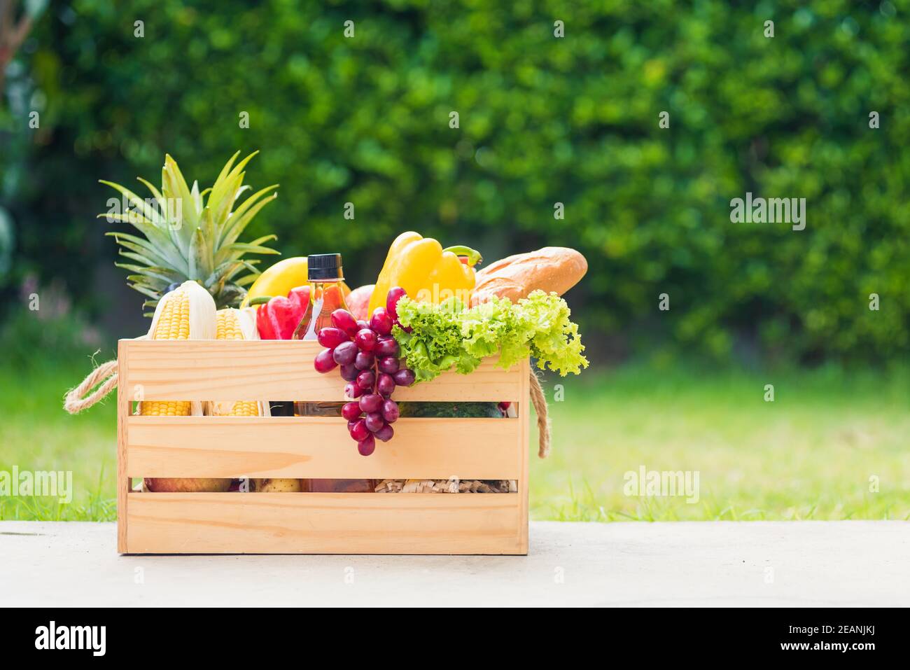 Full fresh vegetables and fruits in crate wood box Stock Photo - Alamy
